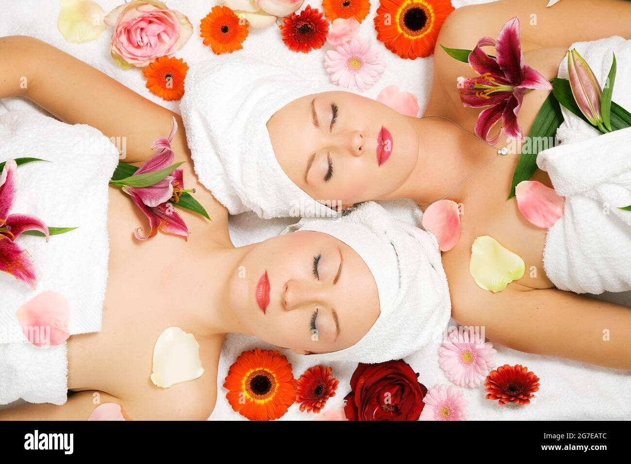 Two girls relaxing in a wellness set-up seen from above, horizontally ...