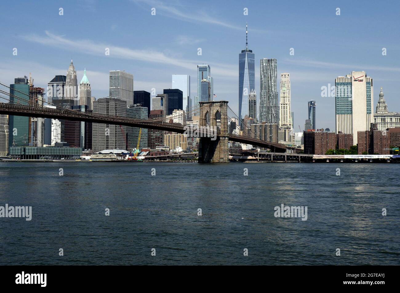 walk lane and bike lane on Brooklyn bridge, with blue sky over ...