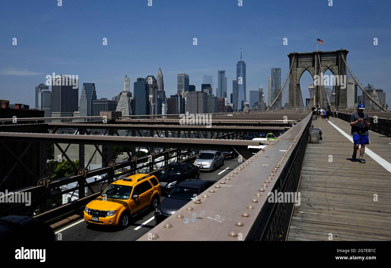 walk lane and bike lane on Brooklyn bridge, with blue sky over ...