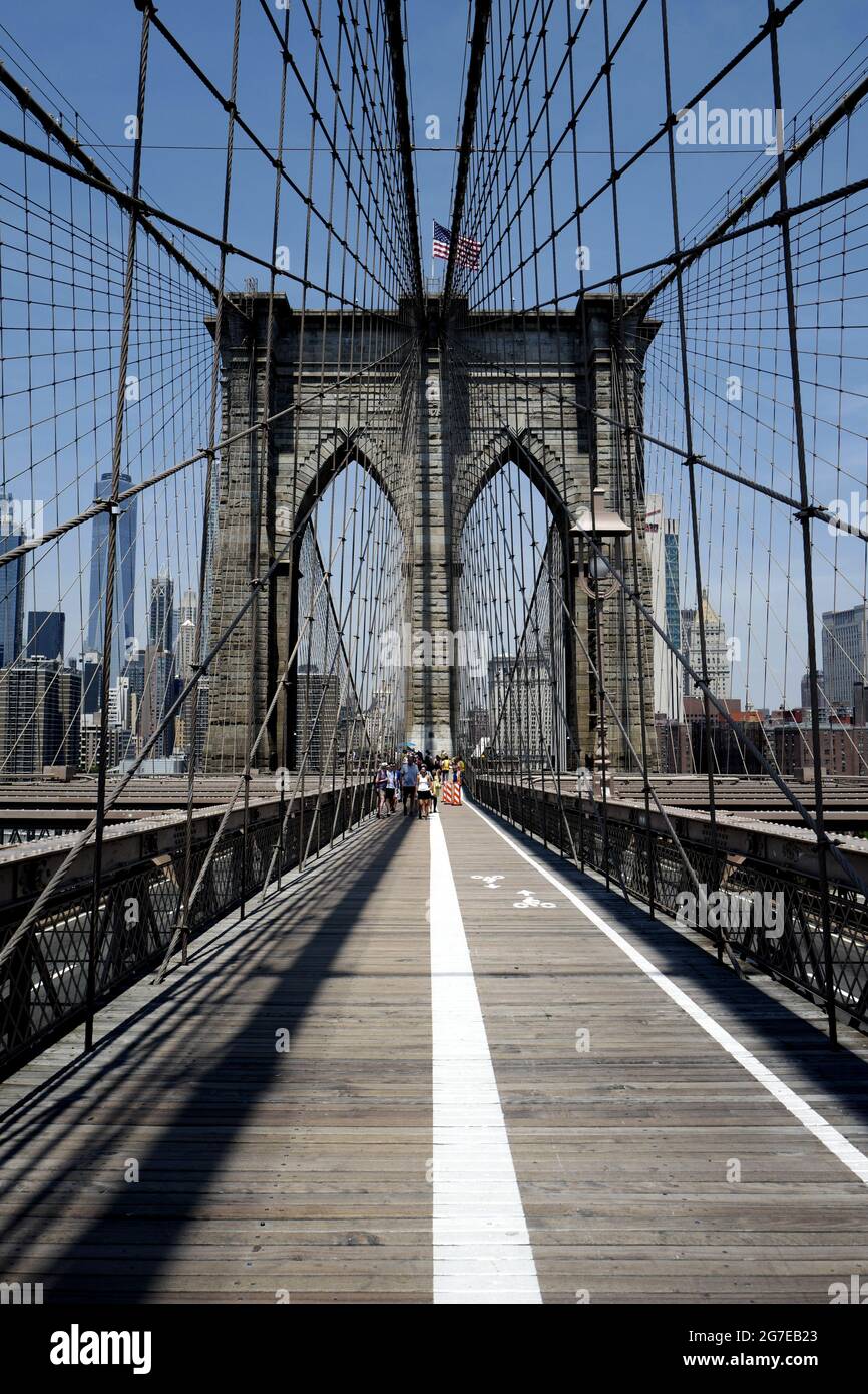 walk lane and bike lane on Brooklyn bridge, with blue sky over ...
