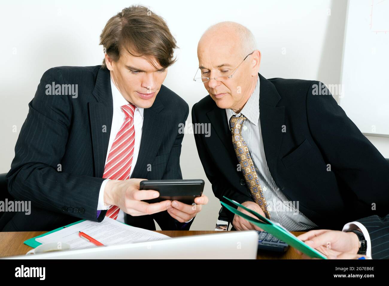 Two businesspeople crunching the numbers Stock Photo - Alamy