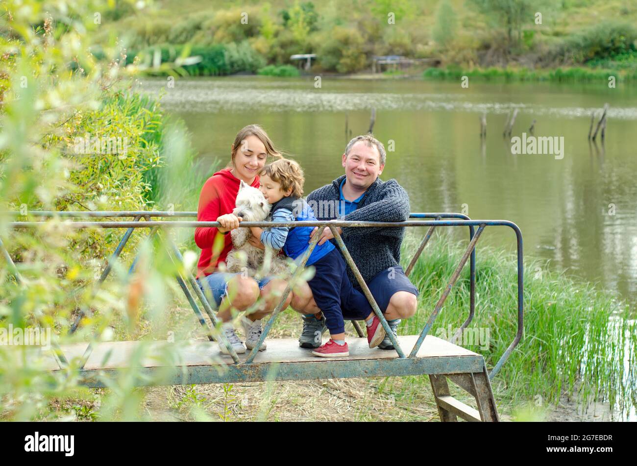 happy family enjoying weekend outdoors Stock Photo - Alamy