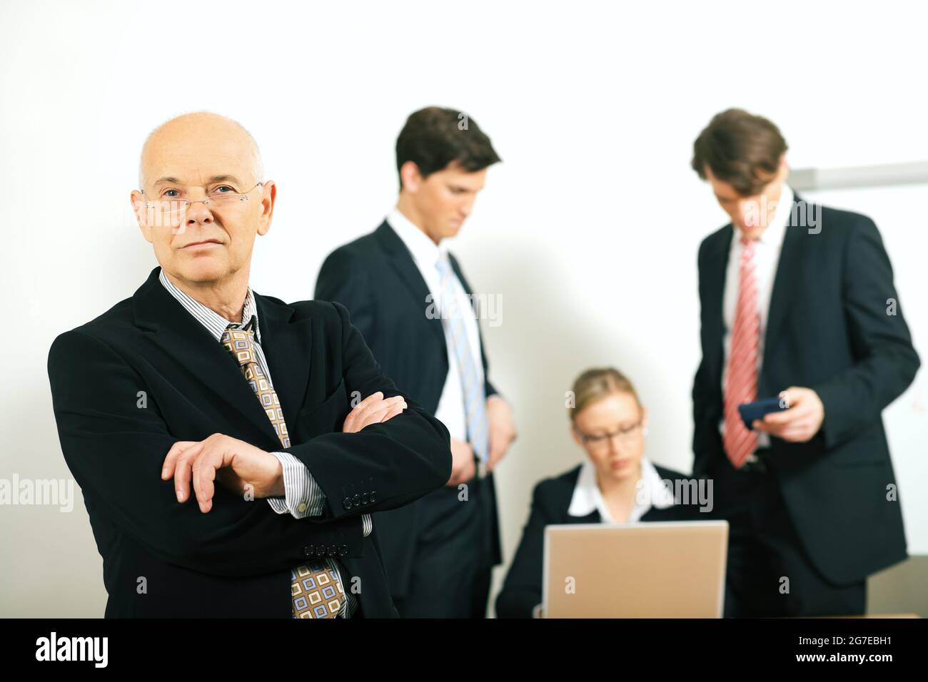 business team with a portrait of the very confident team leader in ...