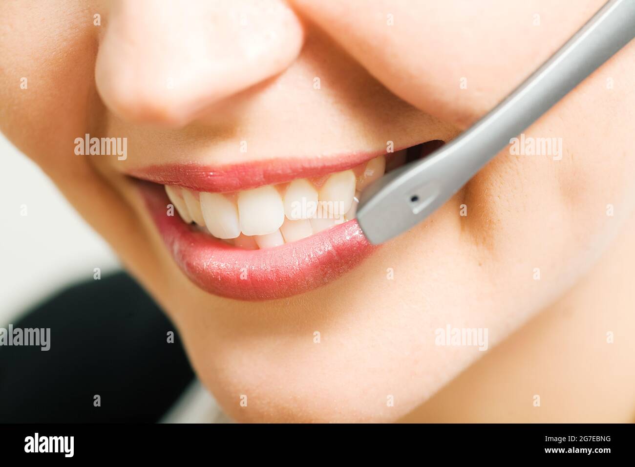 Close-up (mouth) of a friendly female call center operator Stock Photo ...