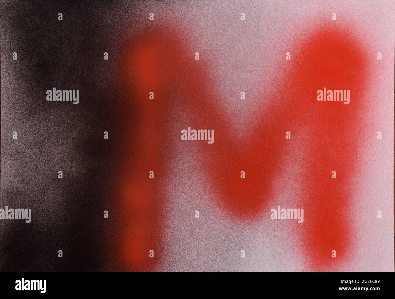 spray painted letter M on black an pink spray wallpaper background ...