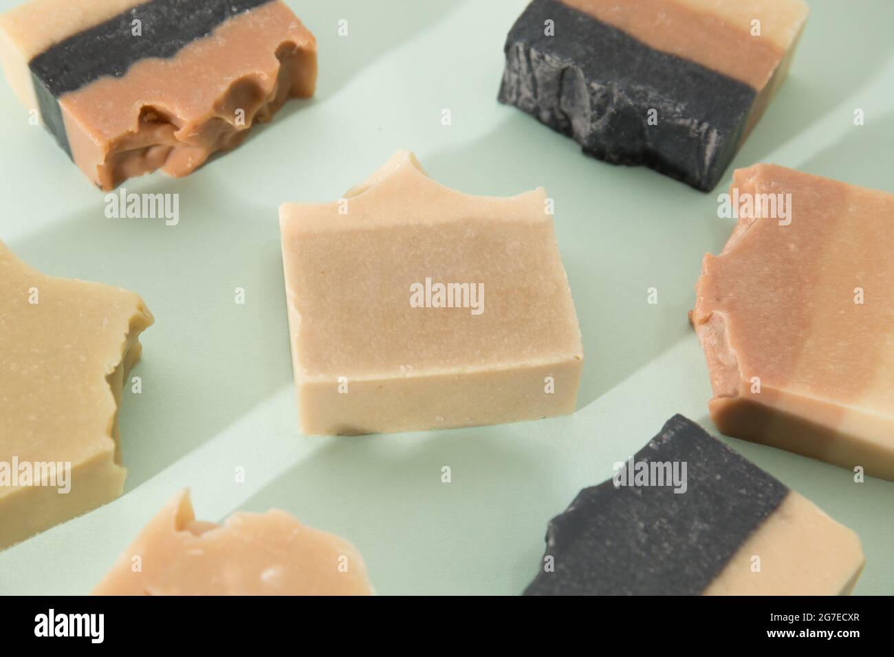 Closeup of handmade bars of hand soap on a green surface Stock Photo ...