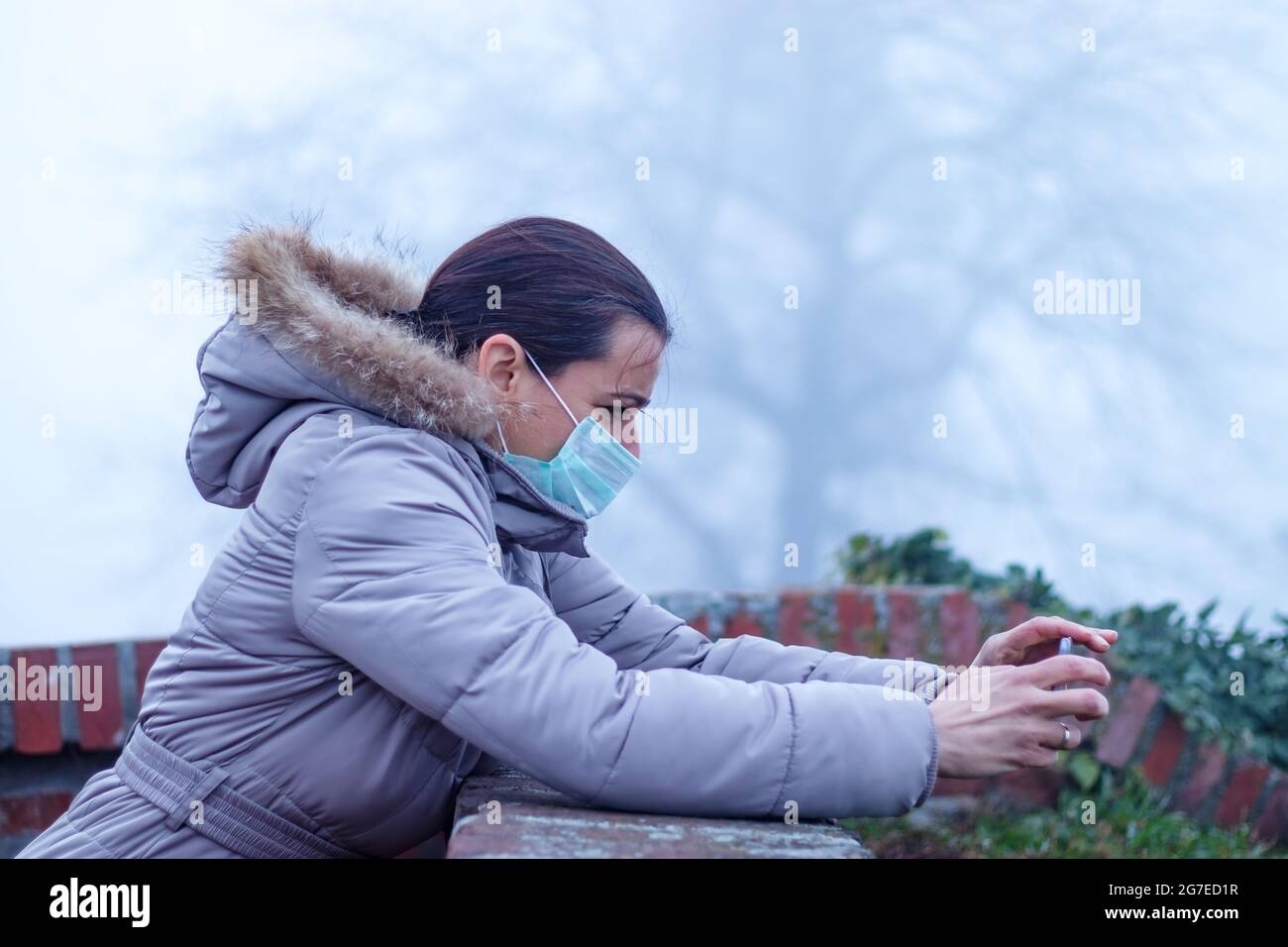 Woman wearing mask to protect her from viruses, smog, poisonous fumes ...