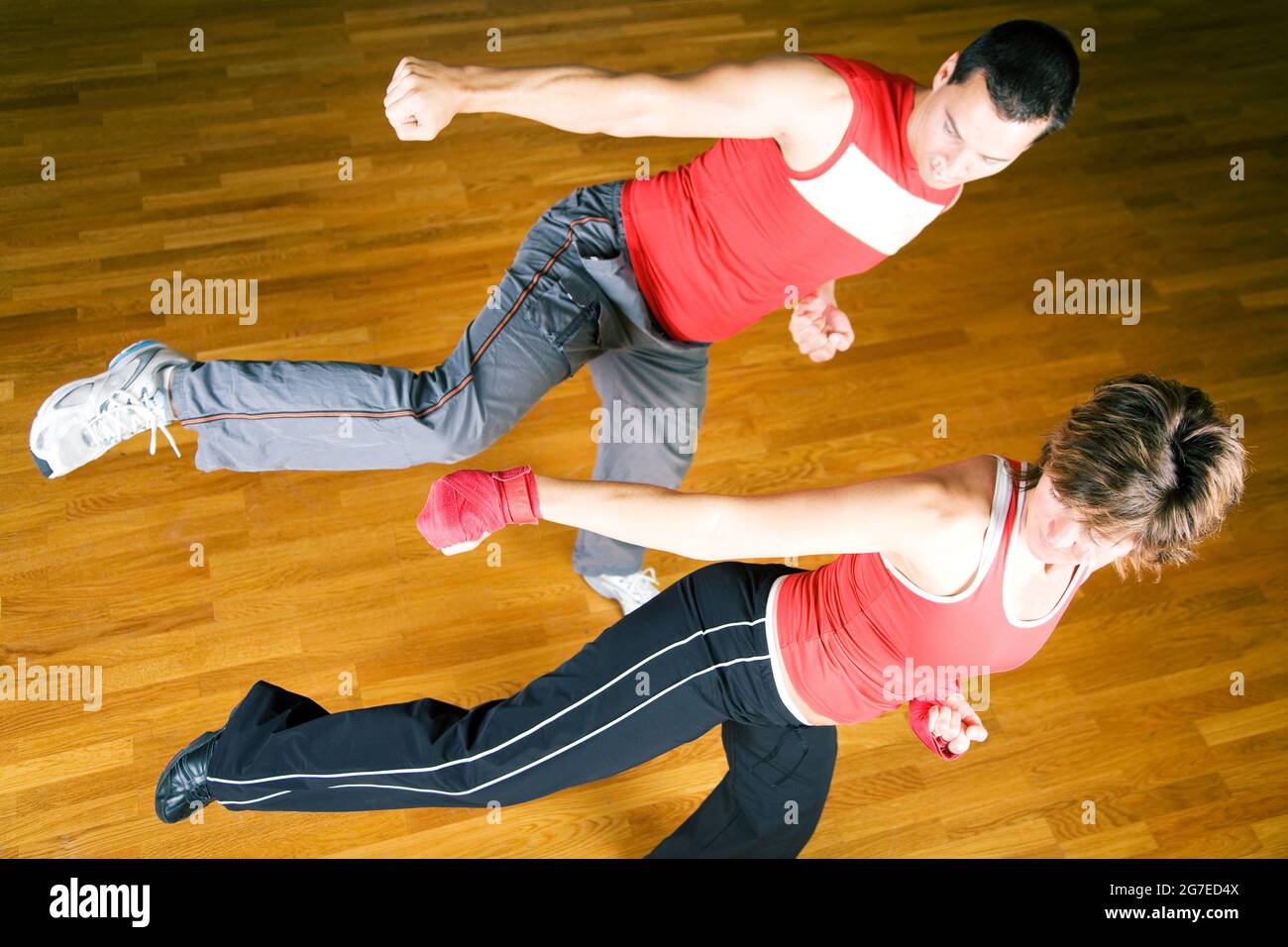 Couple practicing martial art moves in a sparring Stock Photo - Alamy
