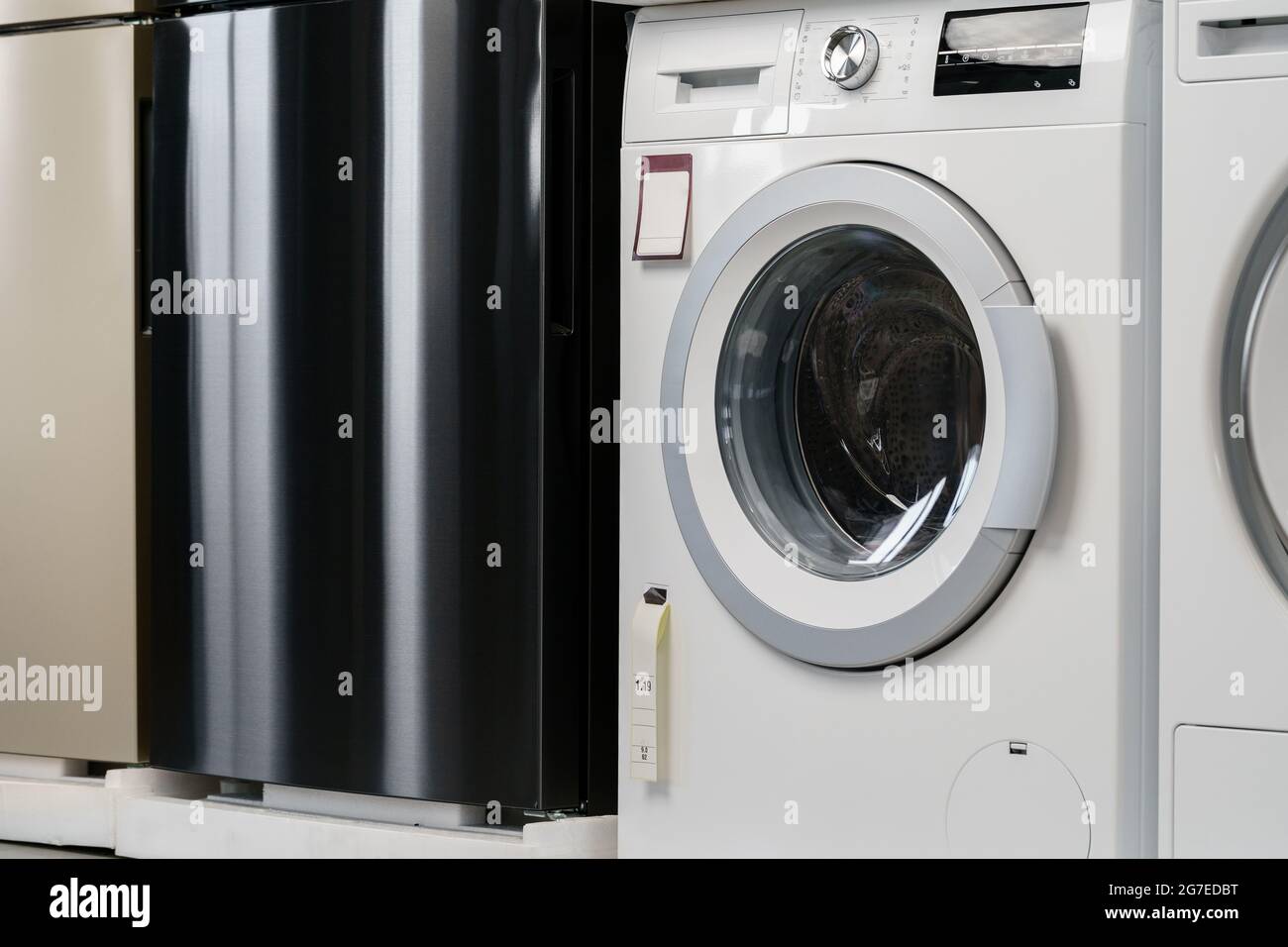New washing machine in a home appliances store Stock Photo - Alamy