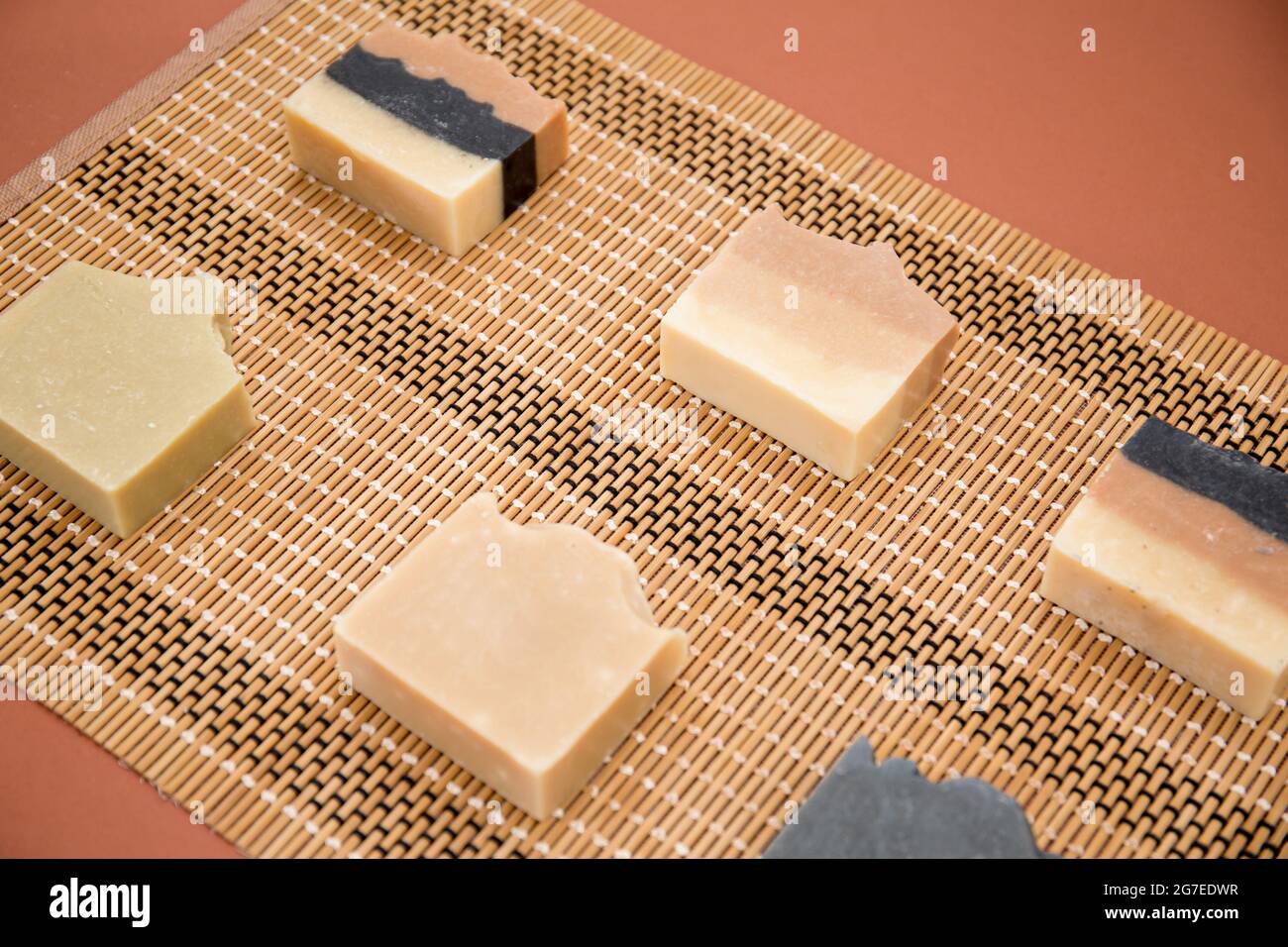 Closeup of handmade soap bars on a wooden surface on the table Stock ...