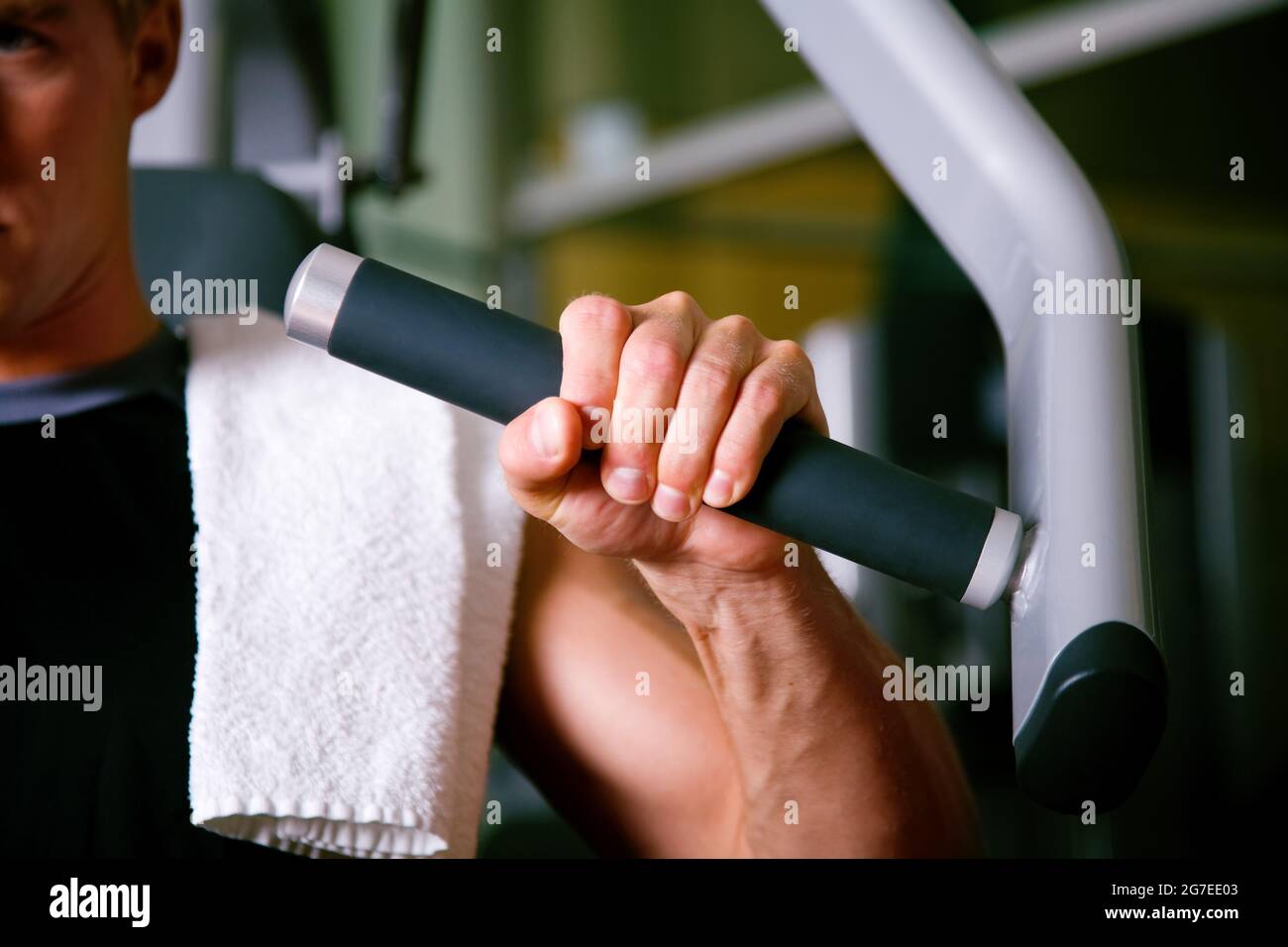 Man lifting weights in a gym, closeup on his hand Stock Photo - Alamy