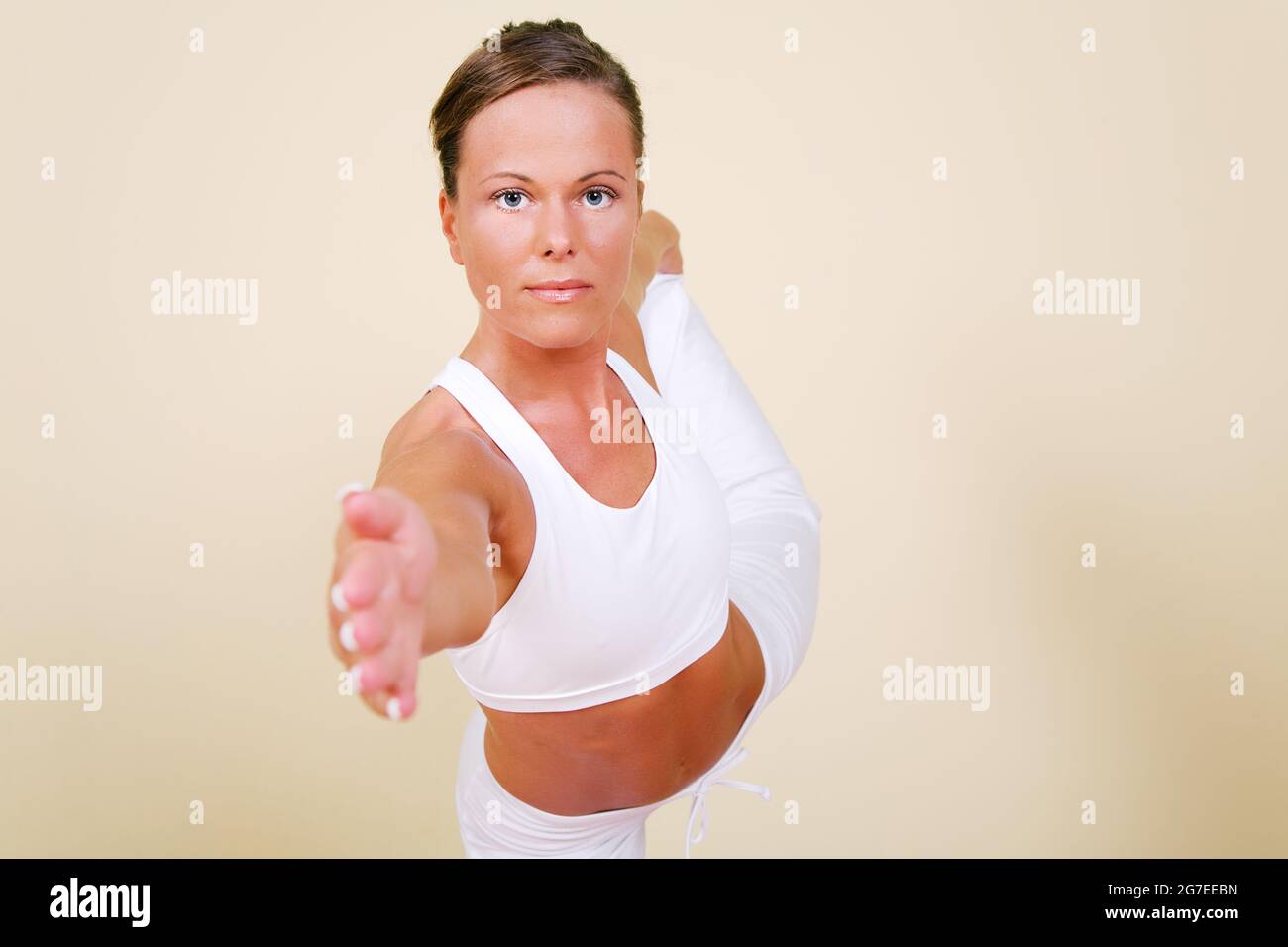 Young woman in a yoga position (Nata Rajasana Stock Photo - Alamy