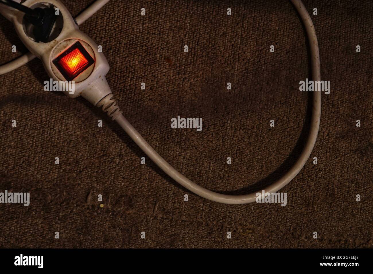 Overhead shot of wires and extension cord on a brown floor Stock Photo ...