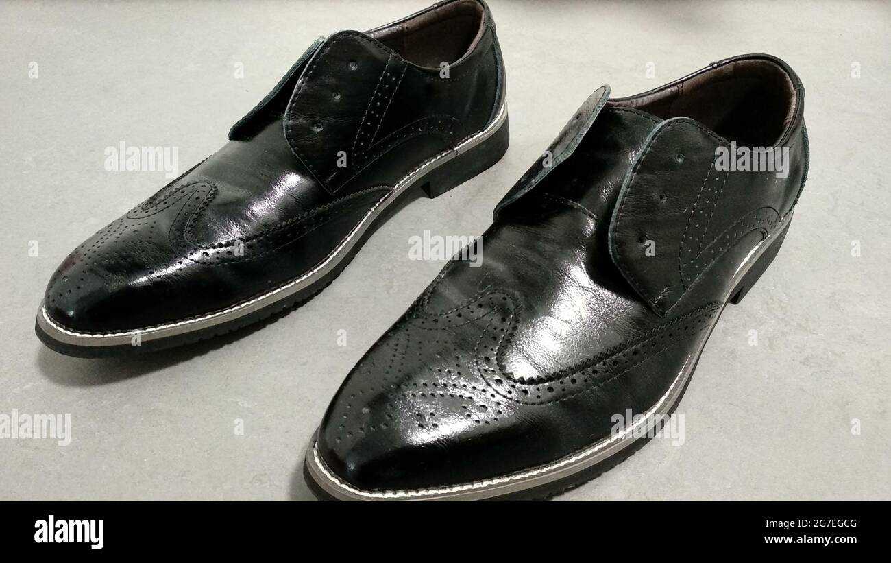 Selective focus shot of men's leather shoes without shoelaces Stock ...