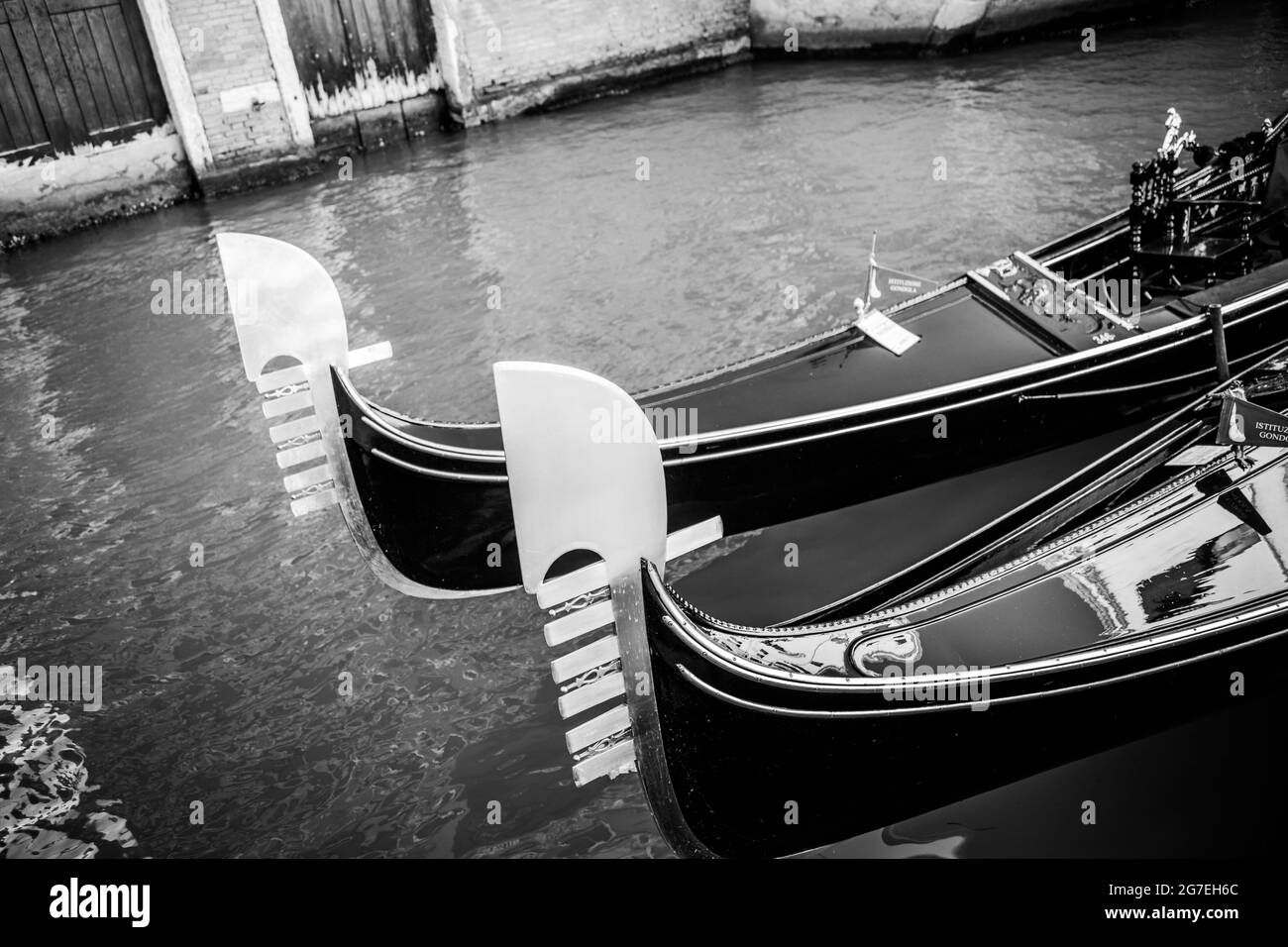 Grayscale shot of boats on the sea in Venice, Italy Stock Photo - Alamy