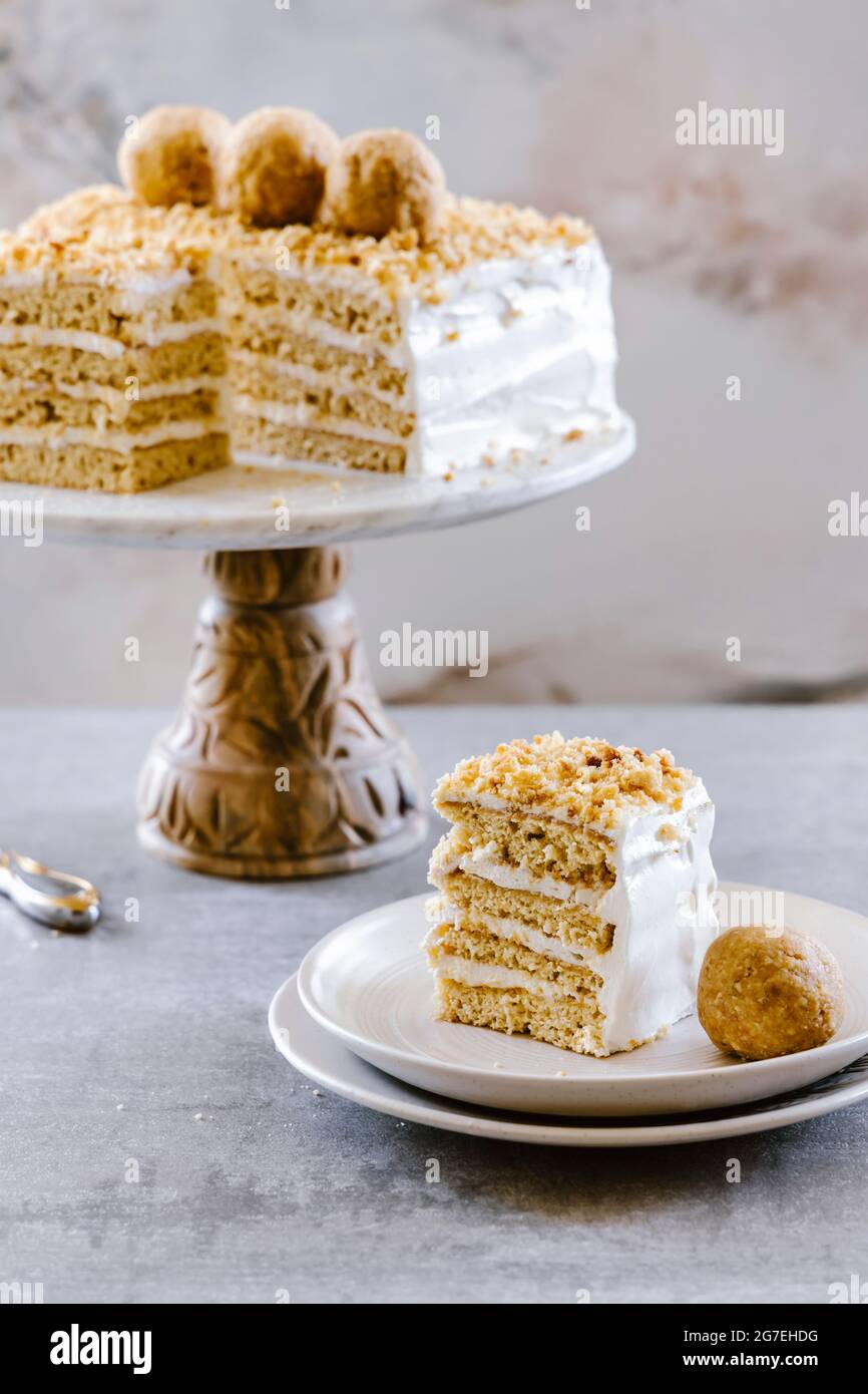 Honey vanilla cake, layers of sponge and cream, covered with a vanilla ...