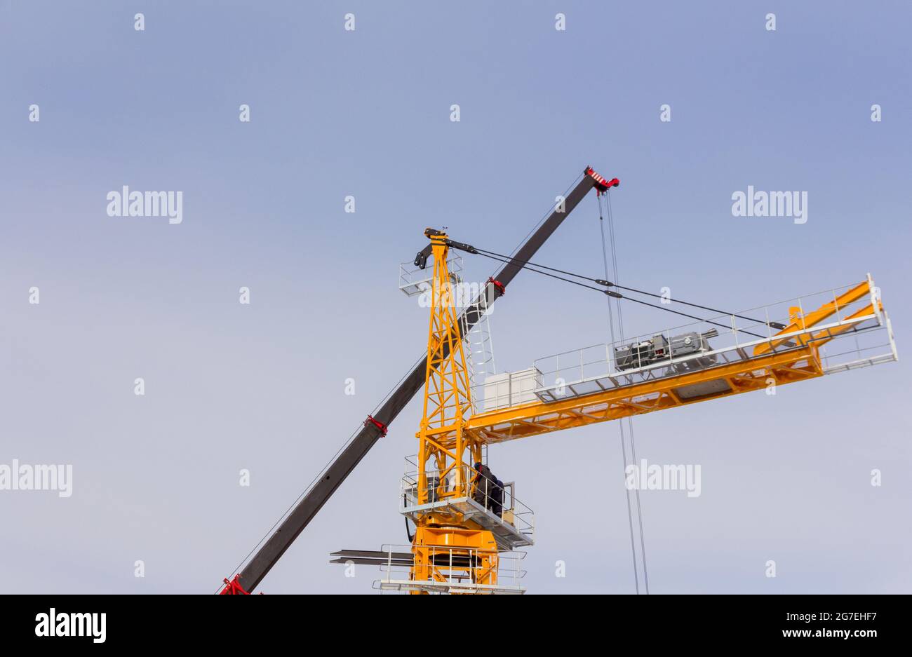 Tower crane assembly. Installation of a construction crane before ...