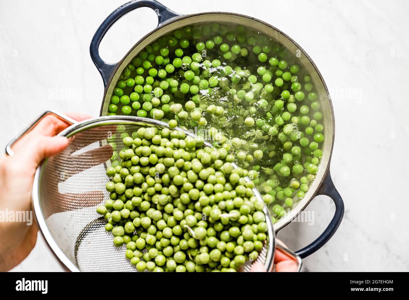 Blanched Green Peas, the preparation and process Stock Photo - Alamy