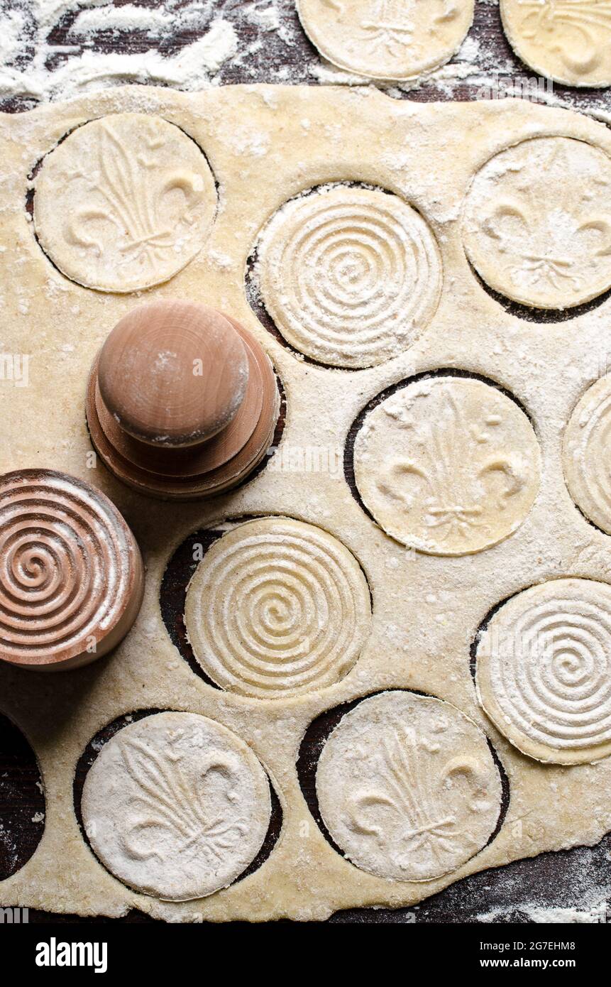 Italian homemade pasta Corzetti being prepared Stock Photo - Alamy