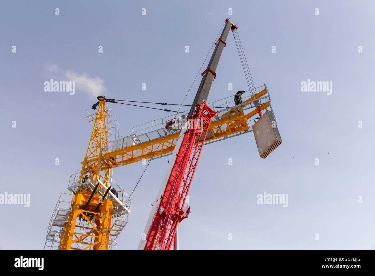 Construction crane assembly stage. Tower crane assembly. Installation ...