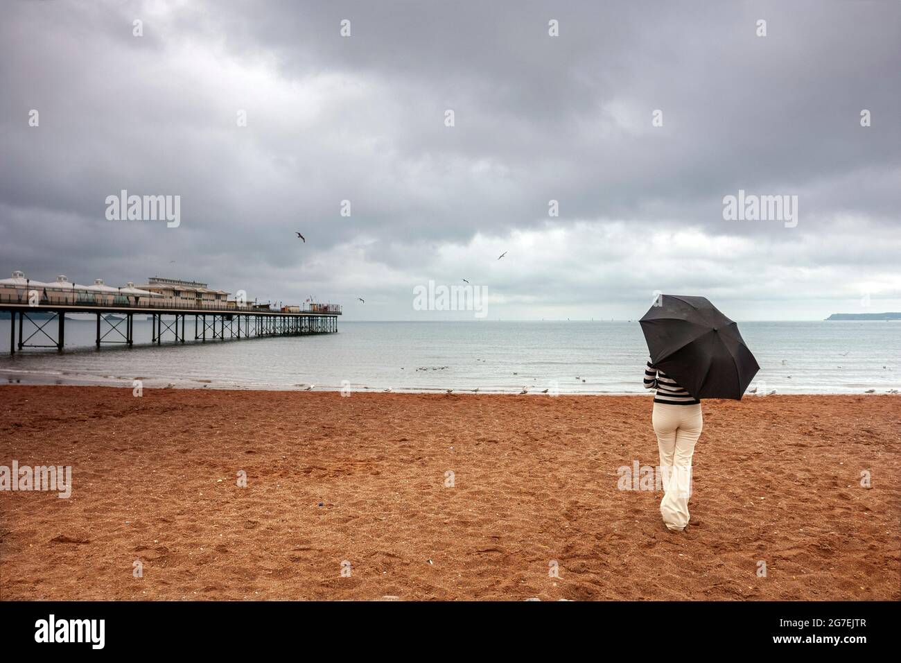 Rain umbrella on beach hi-res stock photography and images - Alamy