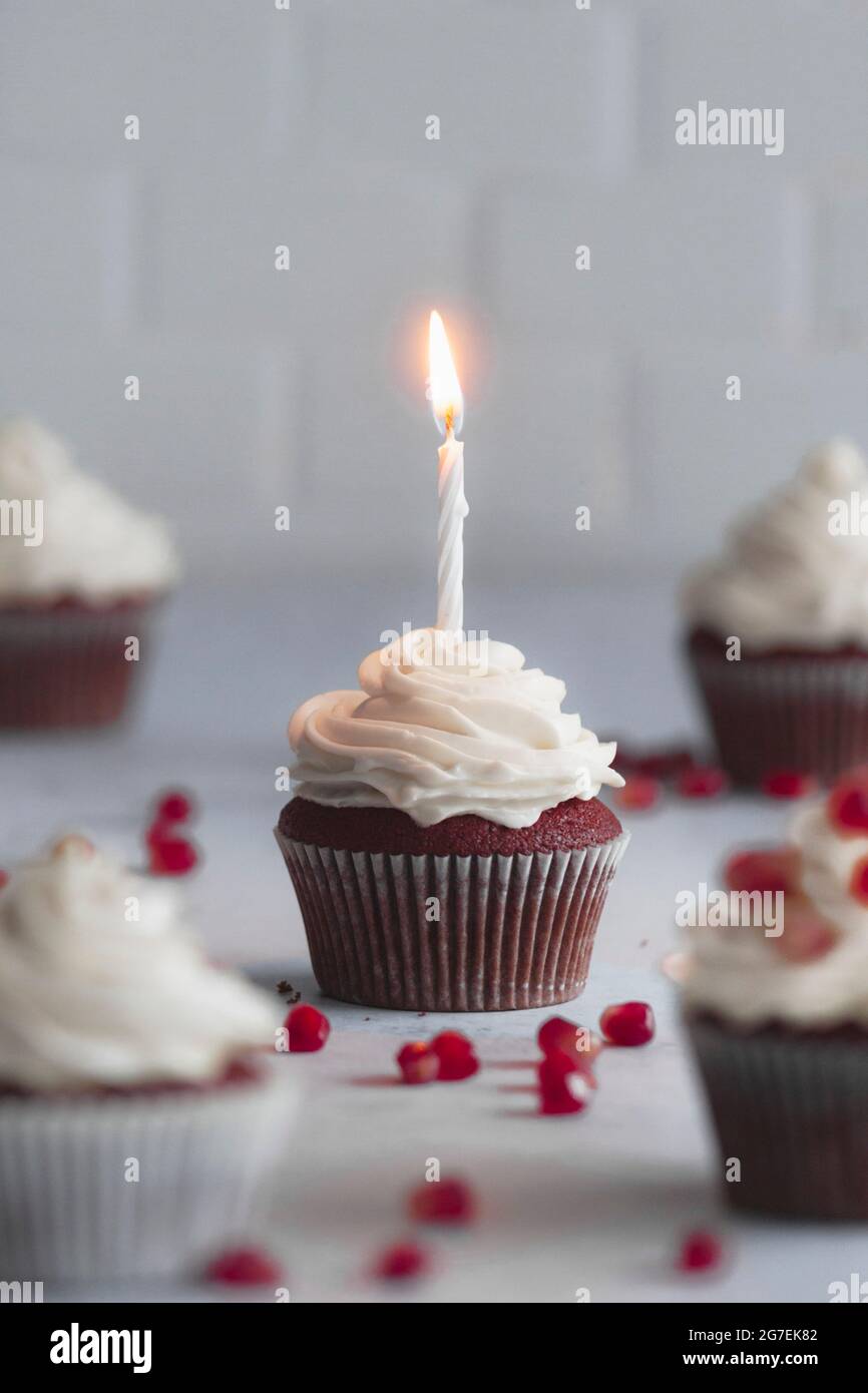 Red velvet cupcakes on a white work surface Stock Photo - Alamy