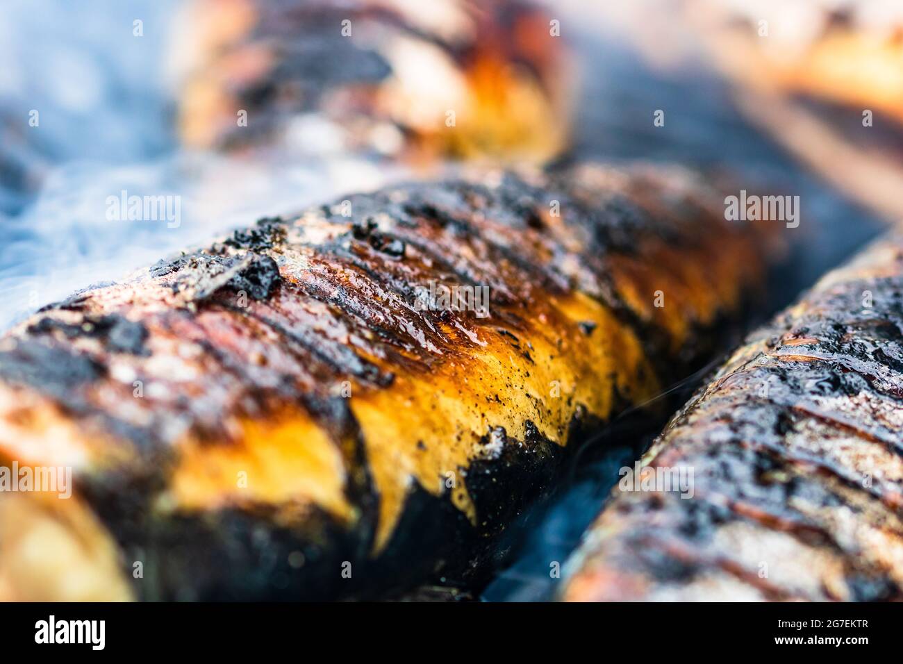 Fish being grilled on a charcoal grill Stock Photo - Alamy