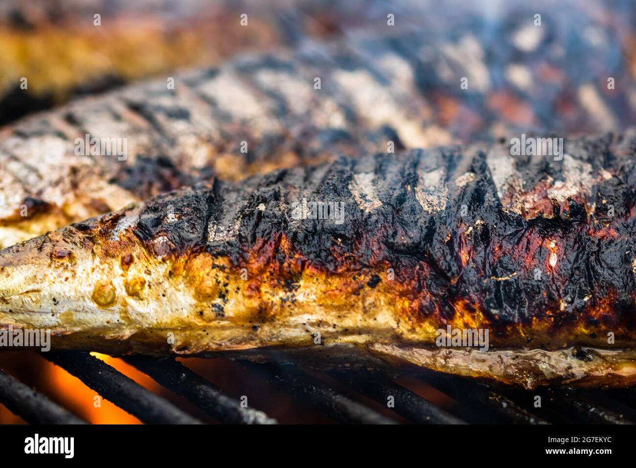 Fish being grilled on a charcoal grill Stock Photo - Alamy