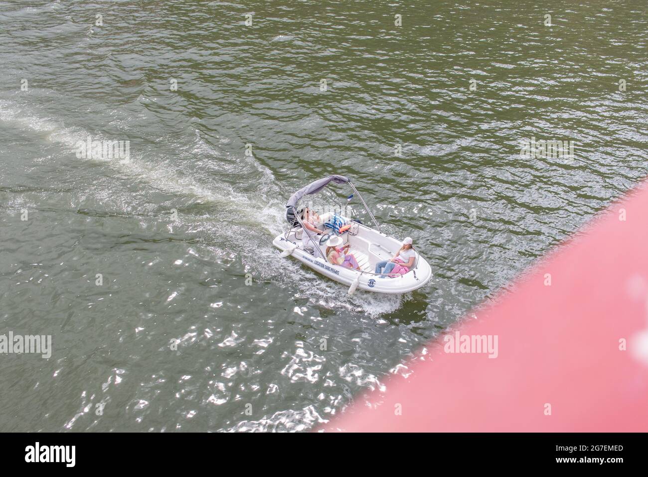 People having fun on a boat captured from the bri Stock Photo - Alamy