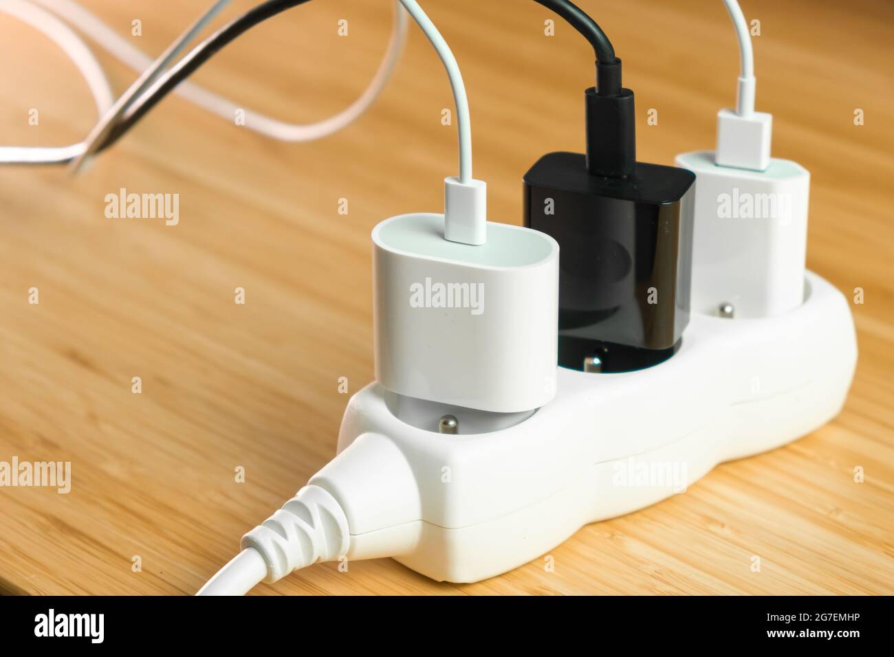 The electrical extension strip with connected white and black power ...