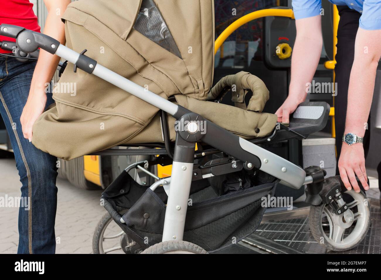 Helping with buggy bus hi-res stock photography and images - Alamy