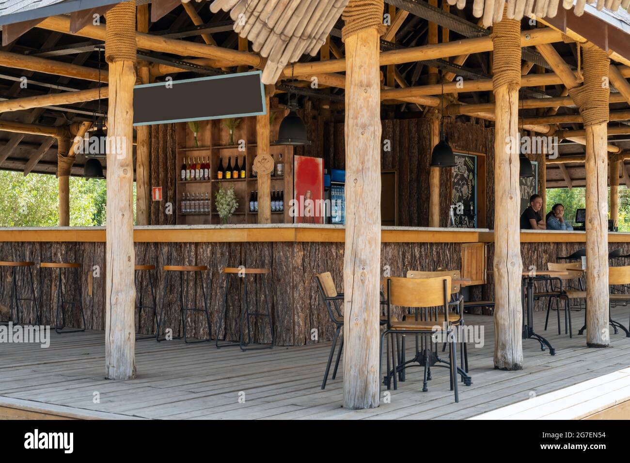 An empty bar on the beach in the early morning. Bartenders are waiting ...