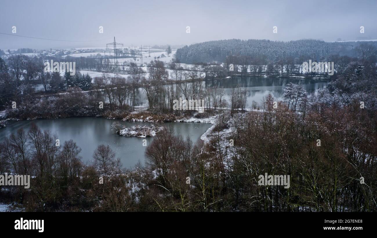 Aerial eye view of frozen ponds in the woods Stock Photo - Alamy