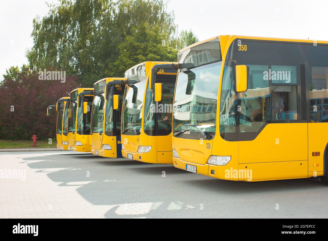 Busses parking in row on bus station or terminal waiting for their next ...