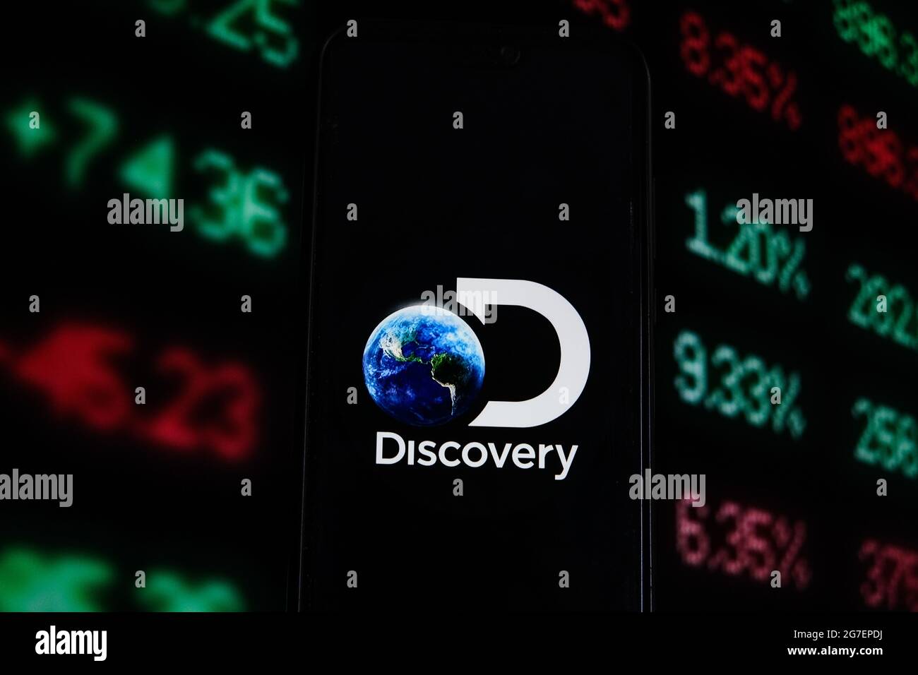 In this photo illustration a Discovery logo is seen displayed on a ...