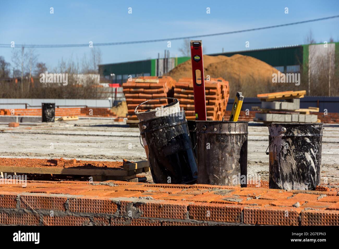 Construction levels and dirty buckets at the construction site ...