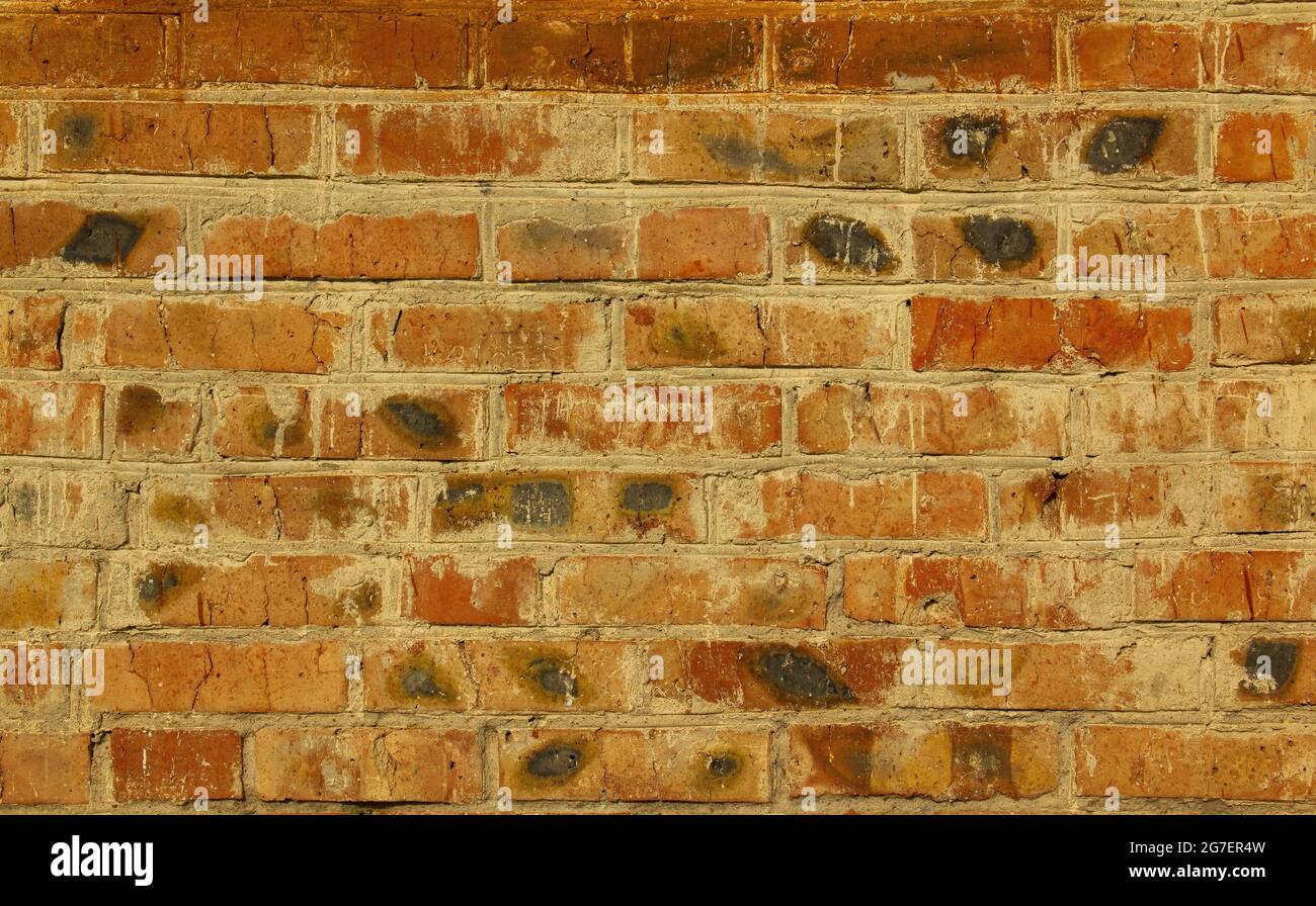 Background looks like a hard burned brick wall. Detail of architecture ...