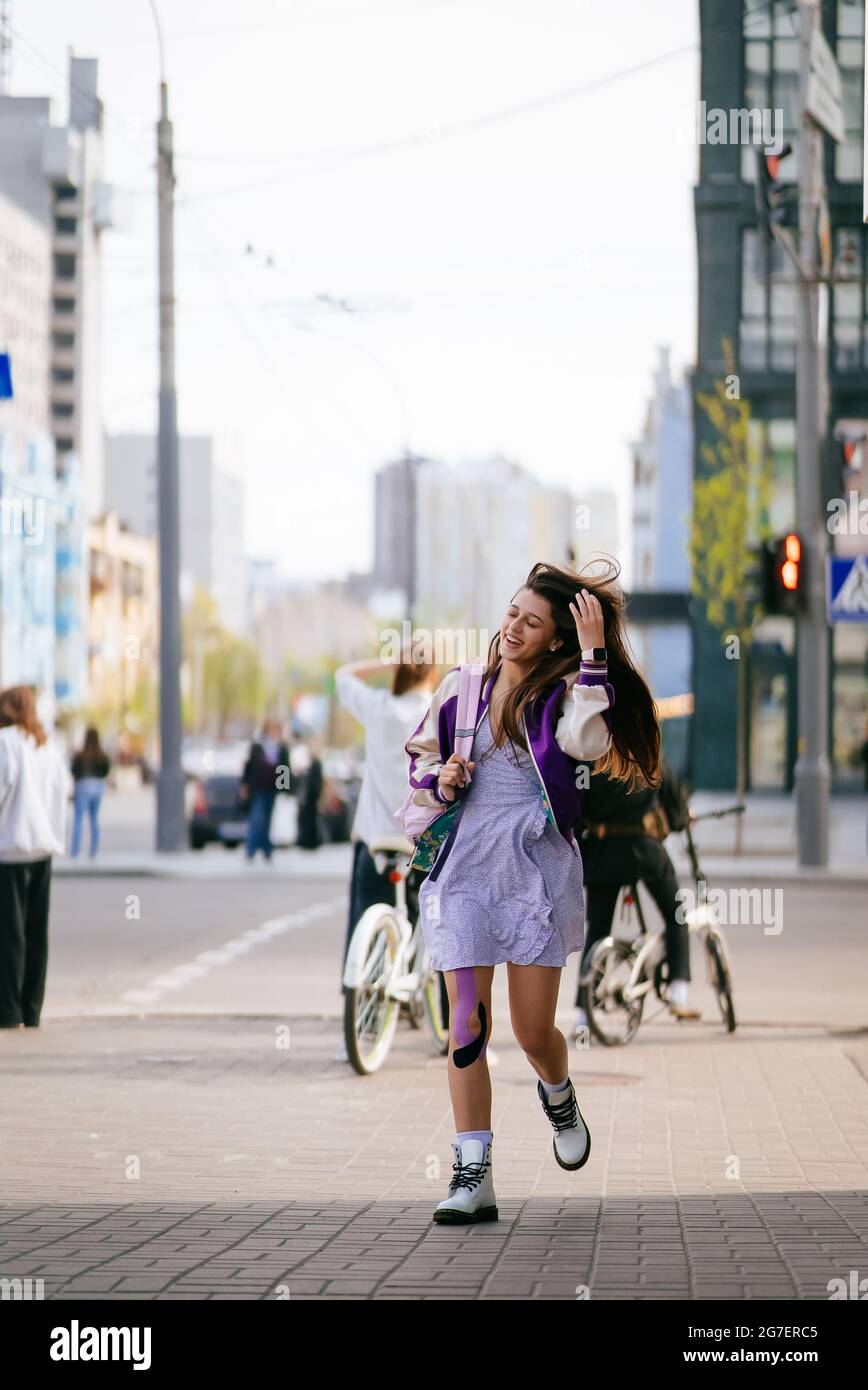 Pretty young woman, walking at the street Stock Photo - Alamy