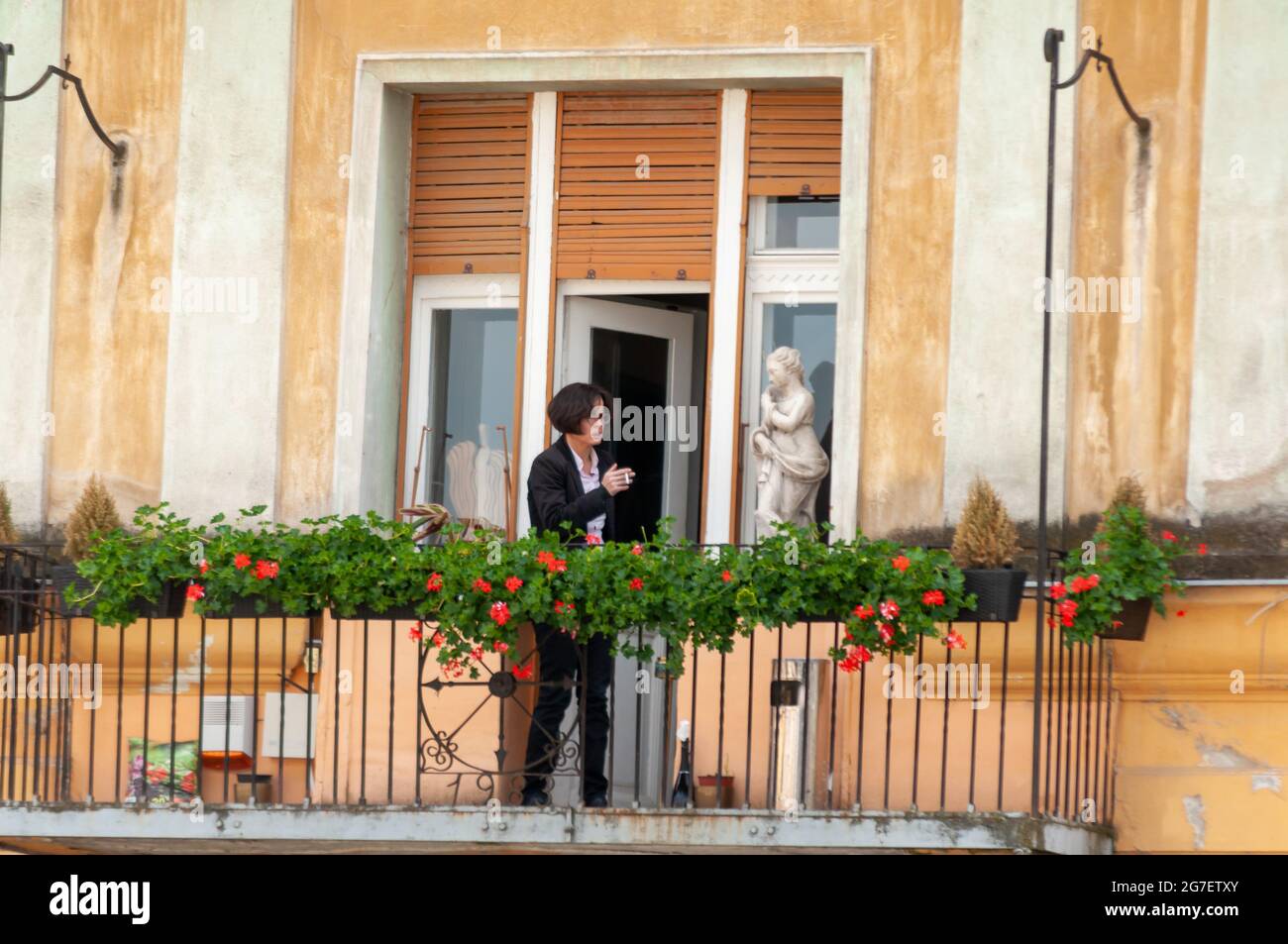 Woman smoking balcony hi-res stock photography and images - Alamy