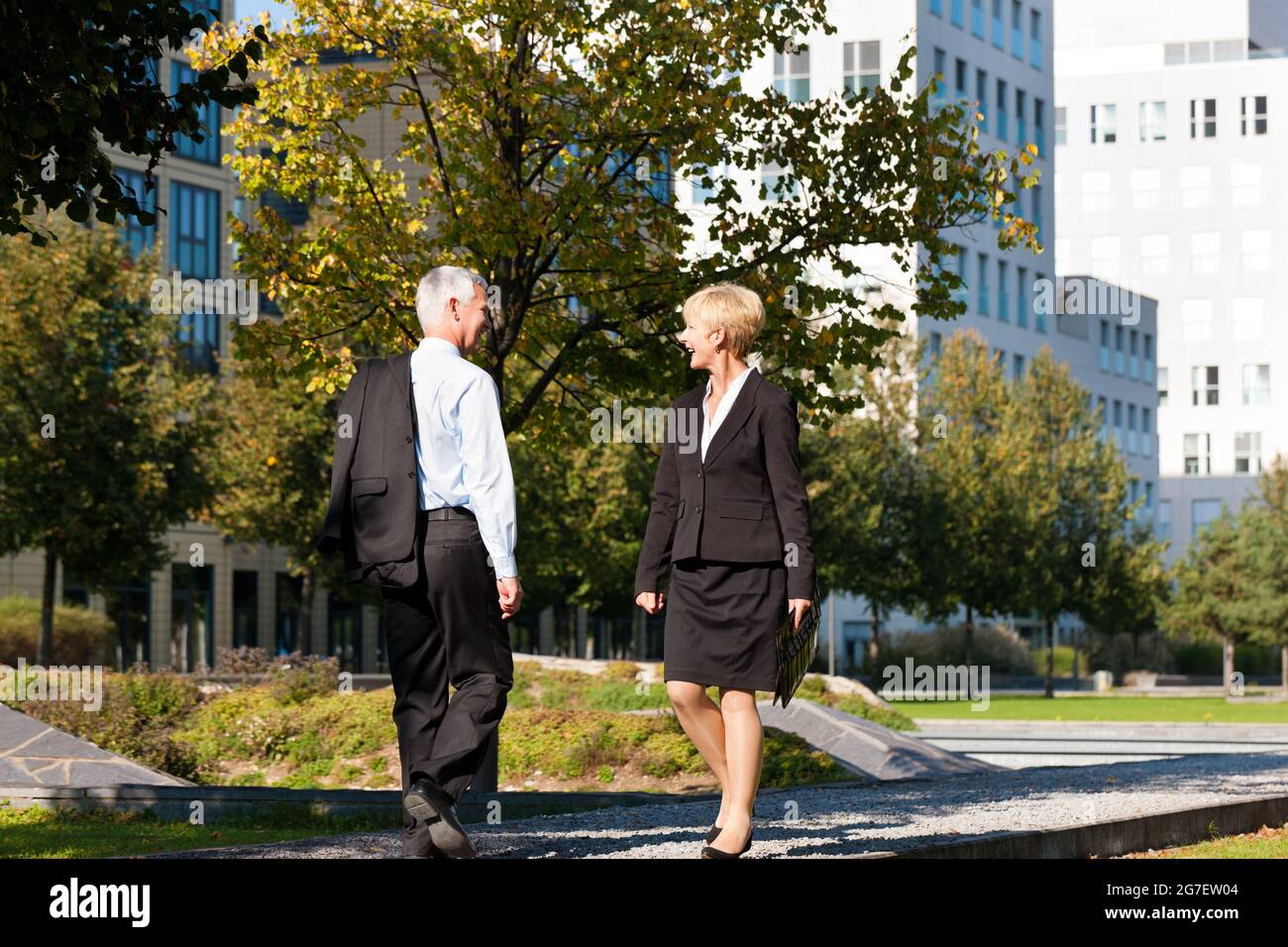 Two businesspeople passing hi-res stock photography and images - Alamy