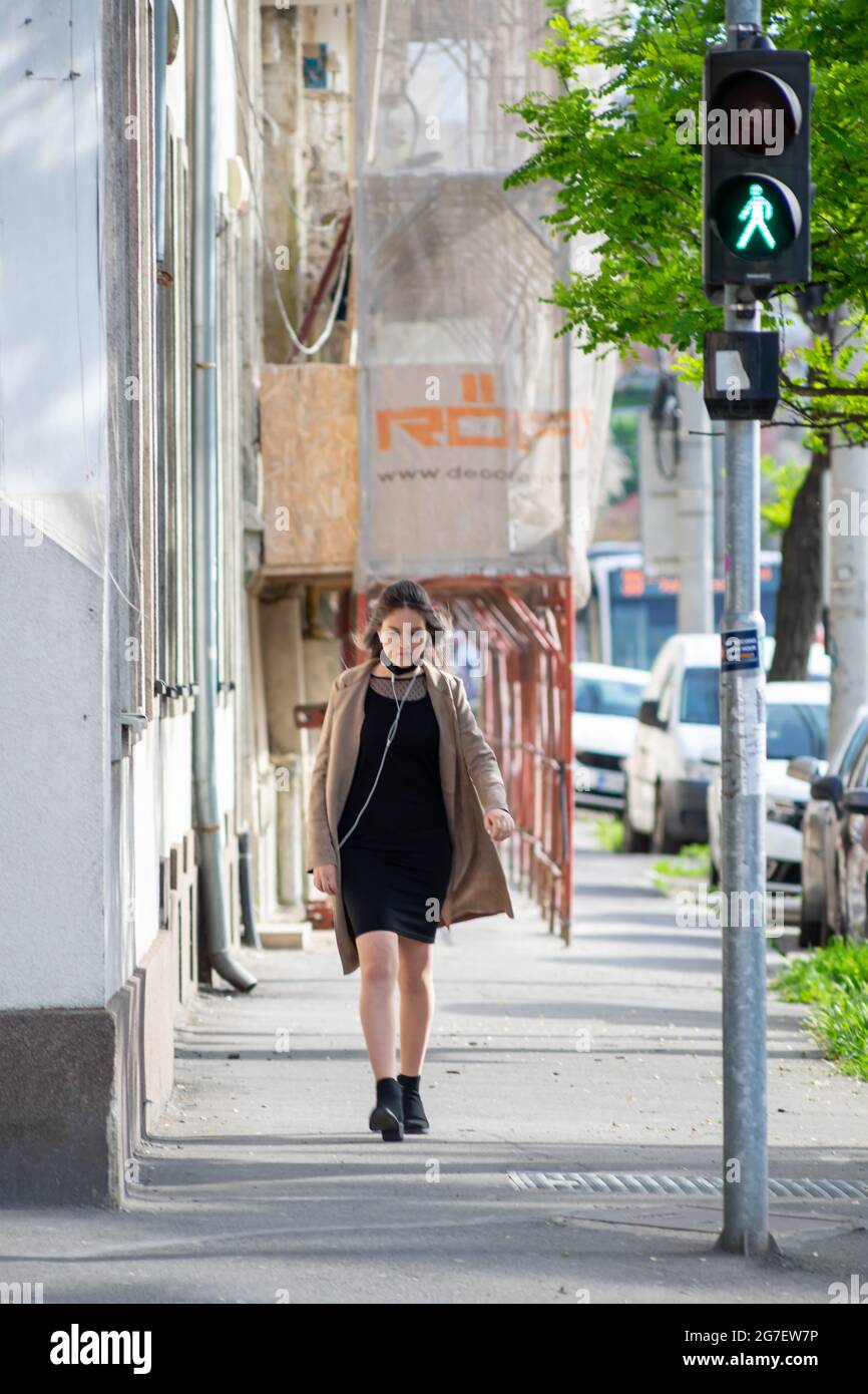 Timisoara, Romania - May 24, 2021: Woman walking on the street. Real ...