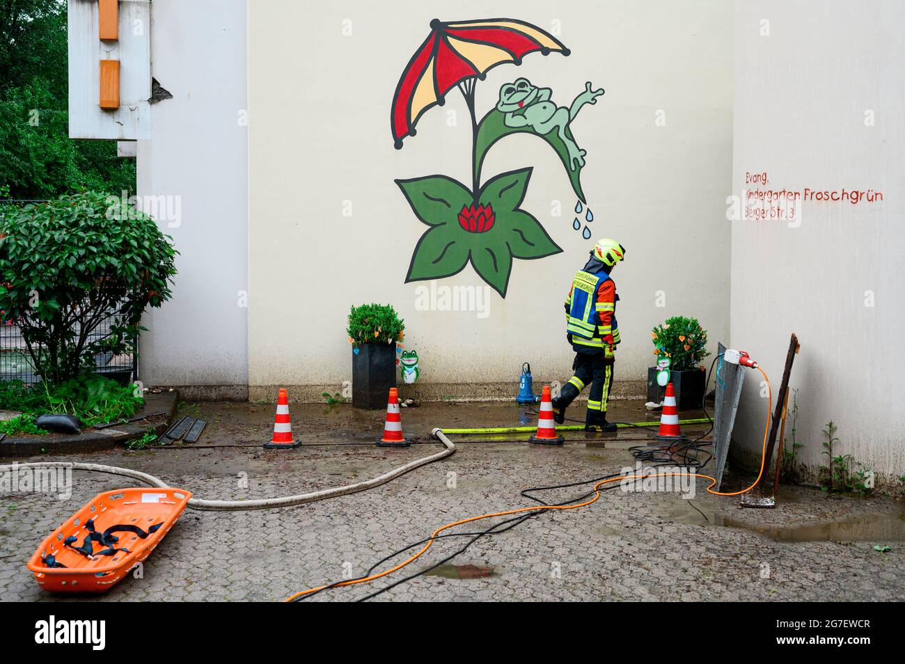 Naila, Germany. 13th July, 2021. Firefighters pump water out of the ...
