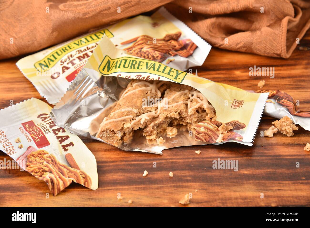 A partially eaten Nature Valley Oat Square on the opened foil wrapper ...