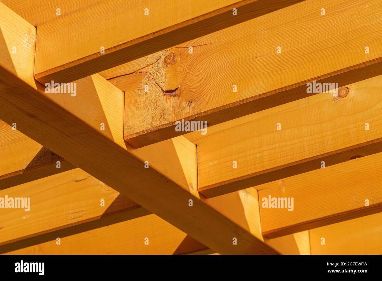 PErgola, wooden beam roof truss construction as architecture background ...