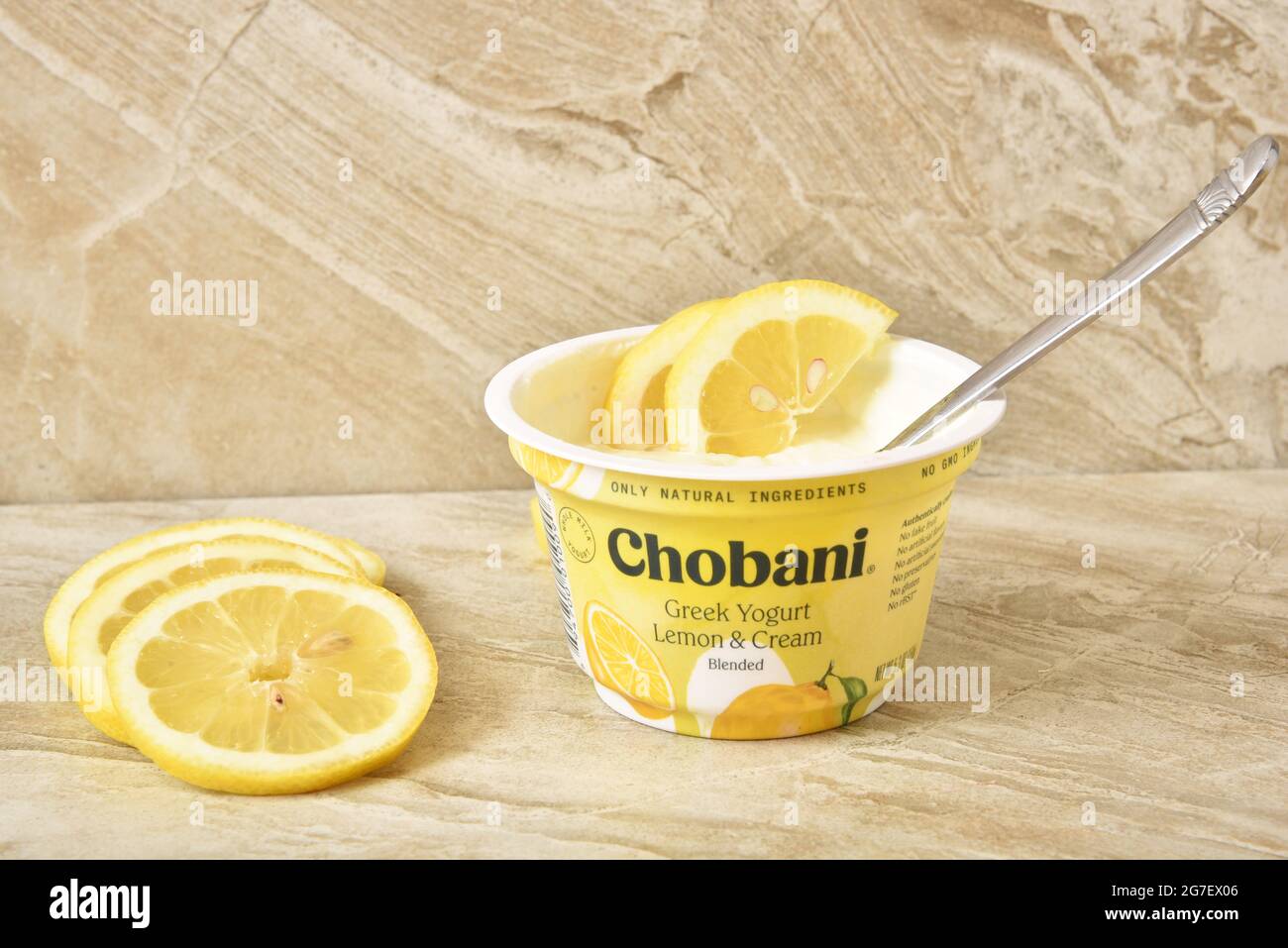 Container of fresh Chobani Lemon Greek Yogurt with a spoon ...