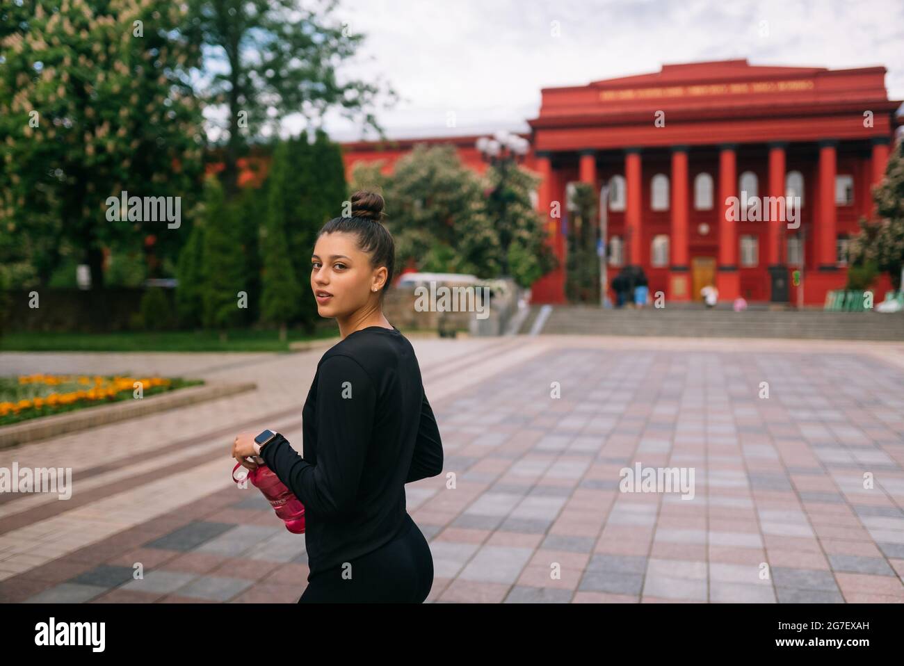 Fitness model in sportswear posing on the city street Stock Photo - Alamy
