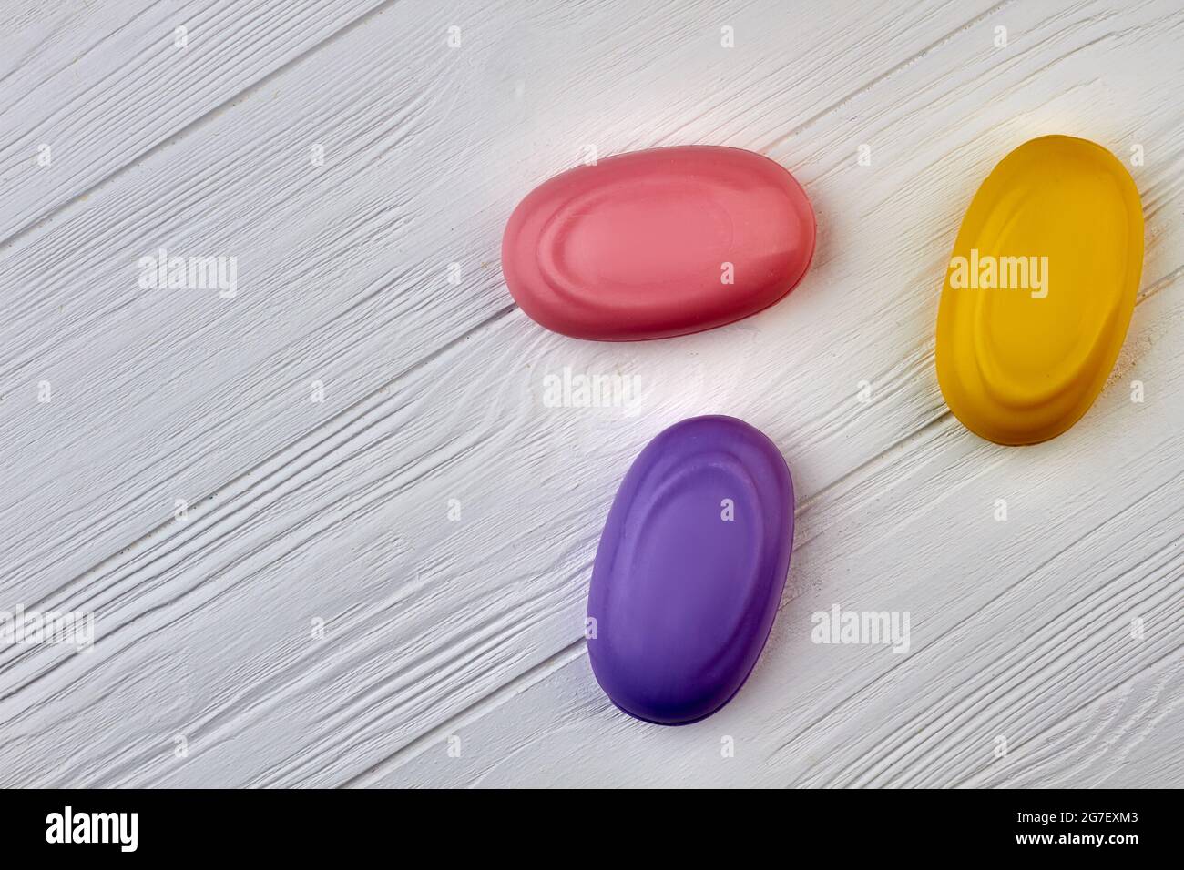 Pink blue and yellow spa hygiene cosmetic soaps Stock Photo - Alamy