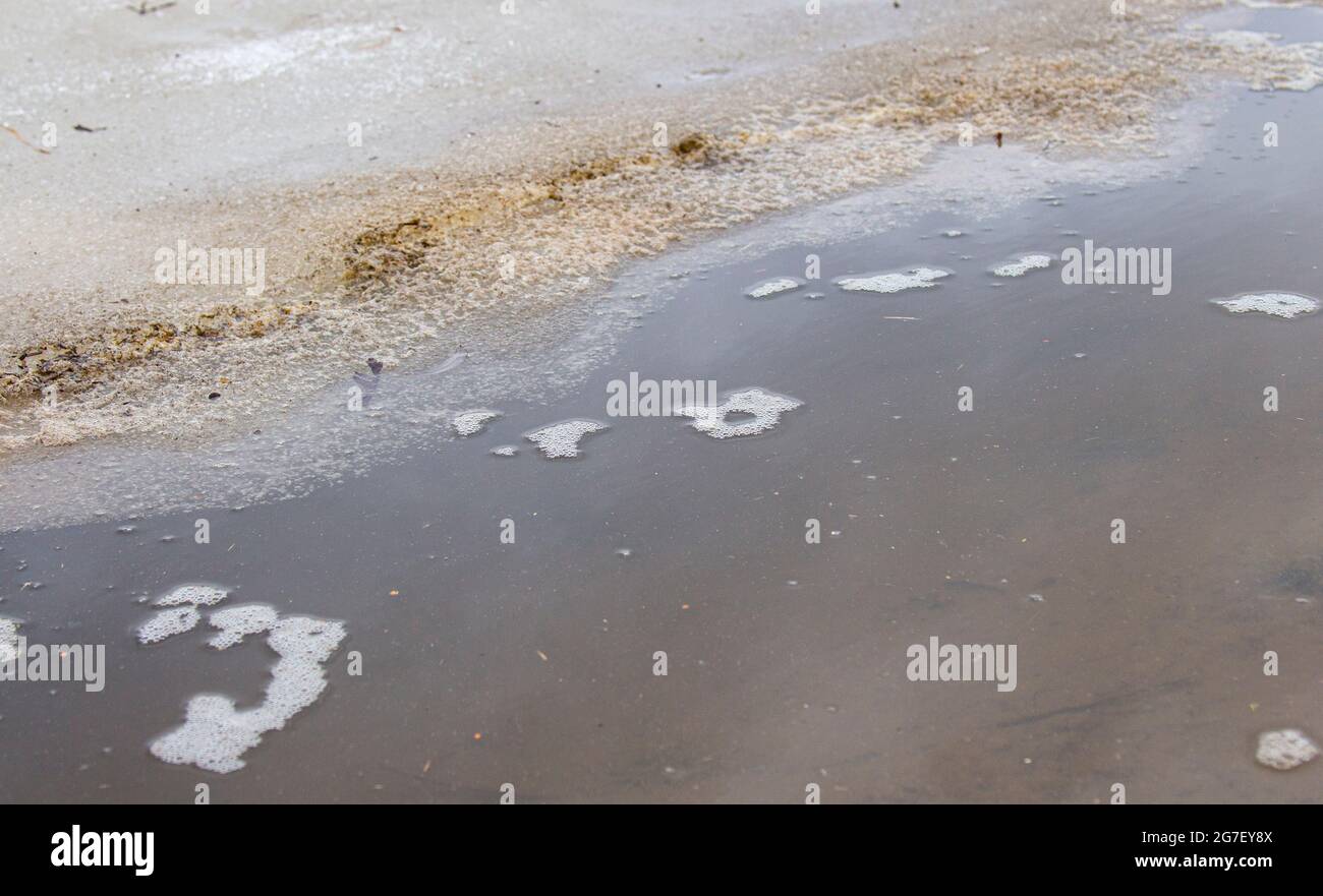 Slush and mud in the water from melting snow during the spring thaw ...