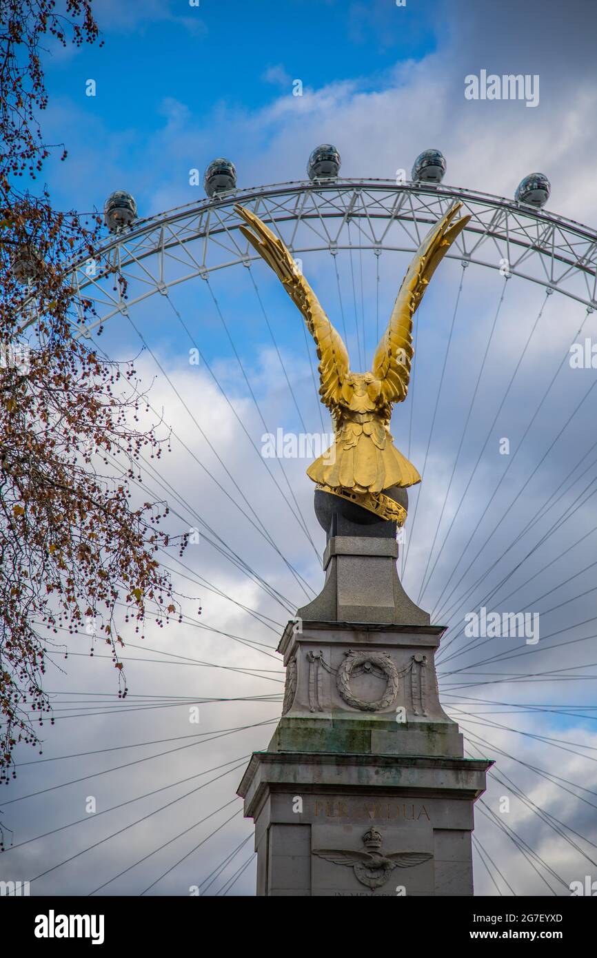Vertical shot of the Royal Air Force Memorial under a blue cloudy sky ...