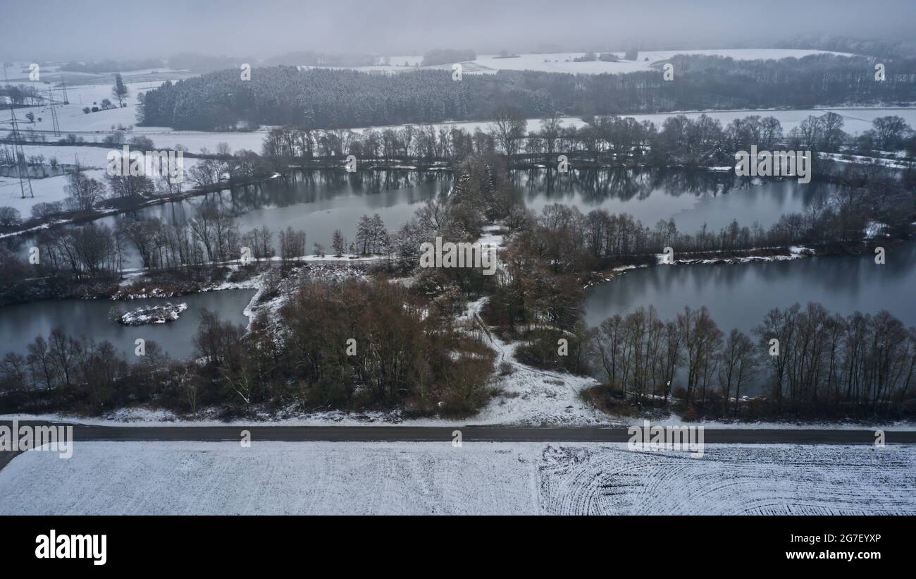Aerial eye view of frozen ponds in the woods Stock Photo - Alamy
